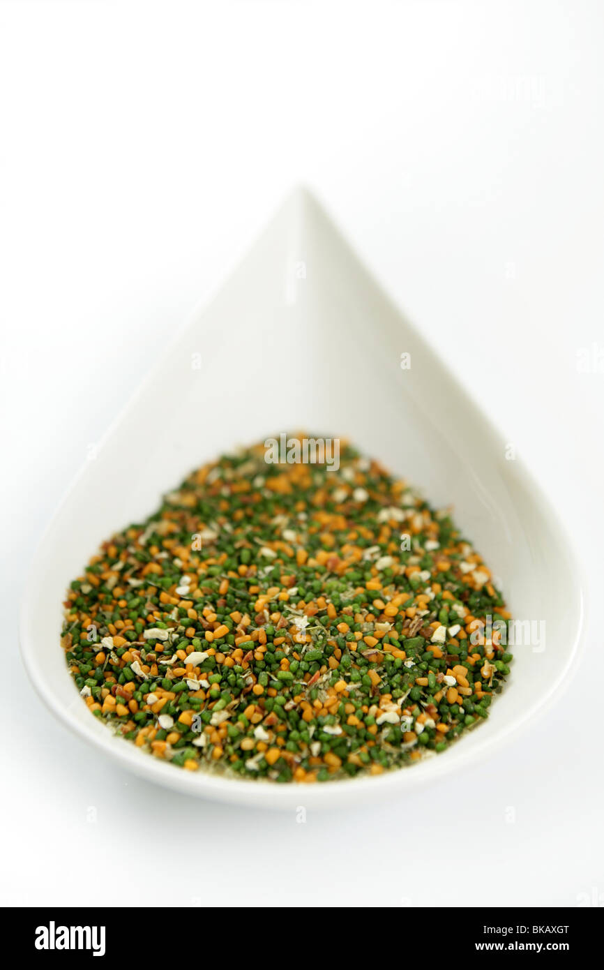 Multicolor vegetables semolina textures in white dish, white background ...