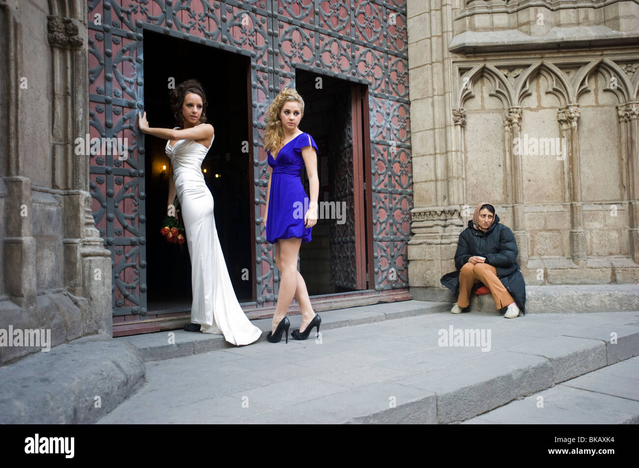 Fotomodels and beggar in Gothic quarter, Barcelona Spain Stock Photo ...