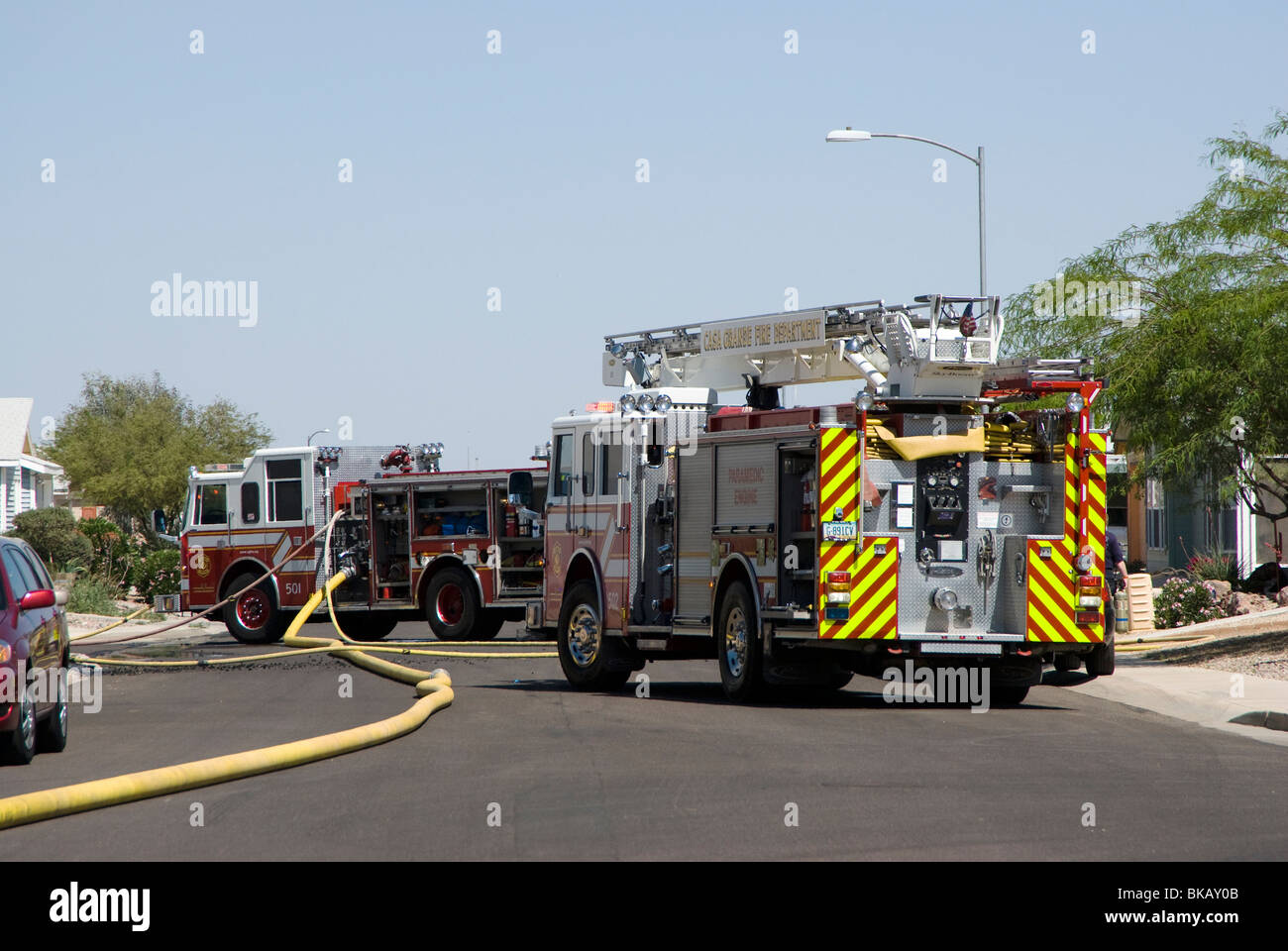 firefighters respond to a house fire in a residential area Stock Photo ...