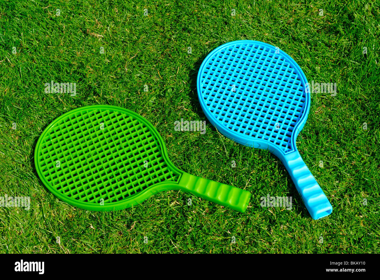 Children's Tennis Racquet's Laying on Lawn Stock Photo - Alamy