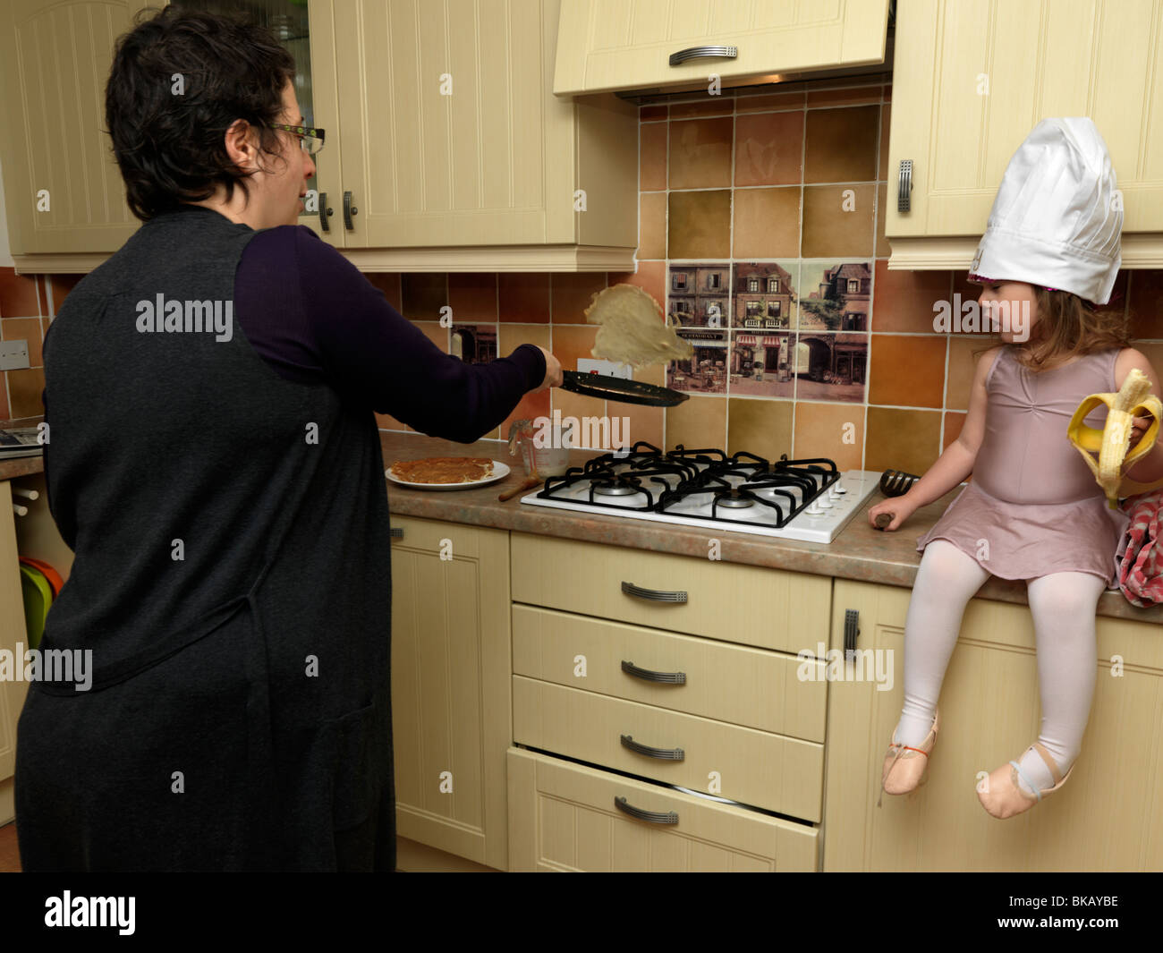 Mother And Daughter Making Pancakes On Shrove Tuesday Stock Photo - Alamy