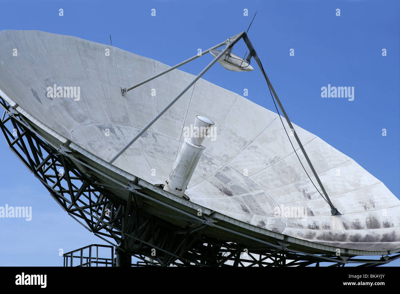 Parabolic satellite dish space technology receiver over blue sky Stock ...