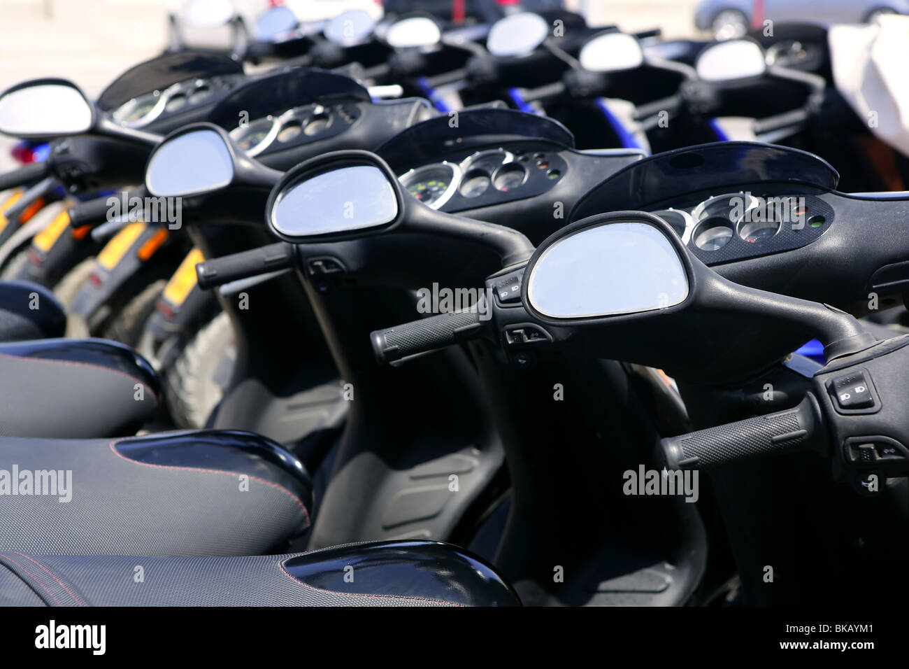 Scooter motorbikes in a row with perspective line Stock Photo - Alamy
