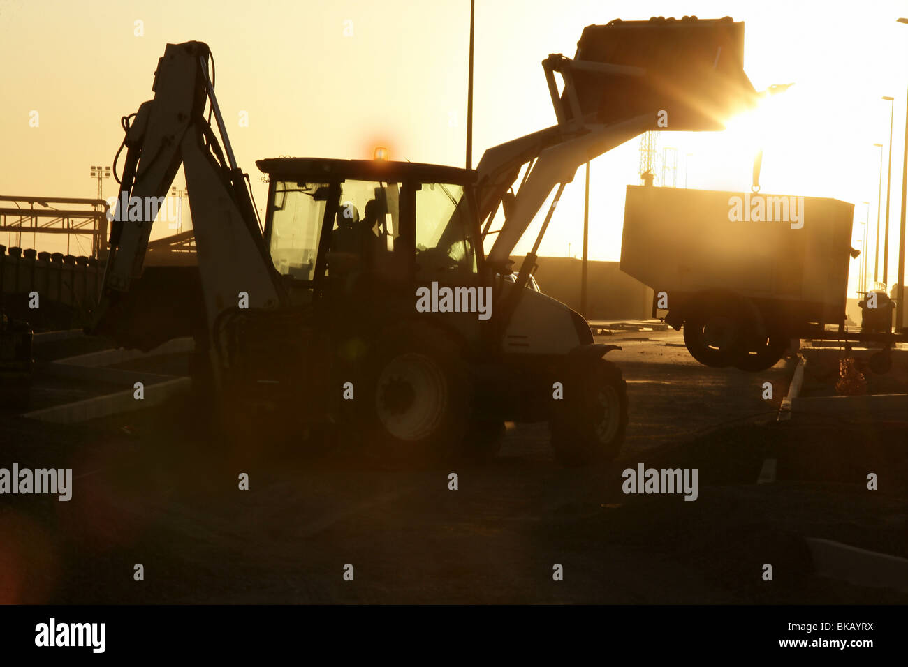 Bulldozer excavator dump backlight under evening sunset light Stock ...