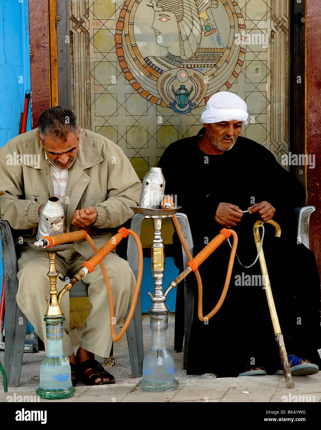 men smoking through a sheesha pipe , Muqattam, a peripheral Cairo slum ...