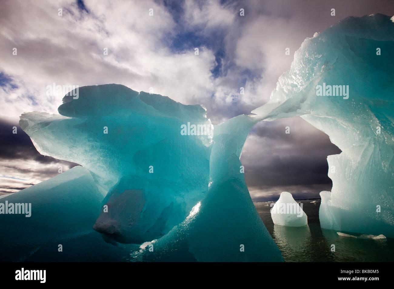 Norway Svalbard Spitsbergen Island Morning sun lights melting arched ...