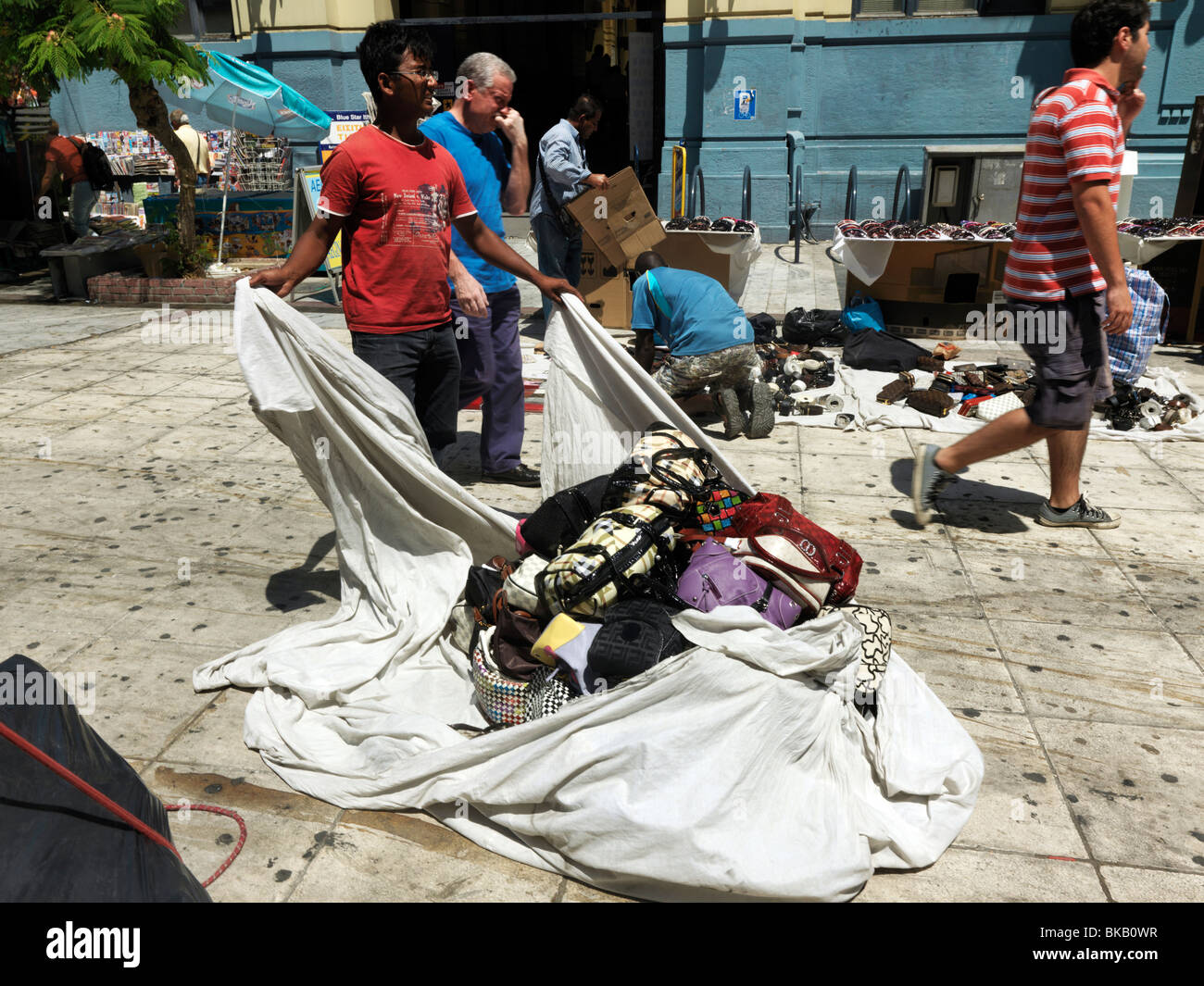 Piraeus Athens Greece Port Flea Market Man Wrapping Bags In A Sheet ...