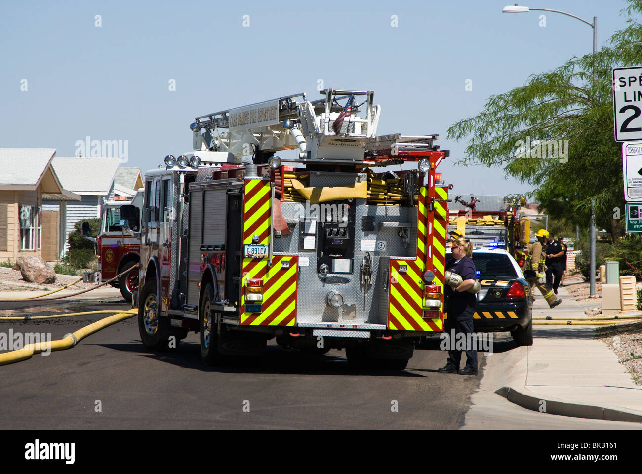 firefighters respond to a house fire in a residential area Stock Photo ...