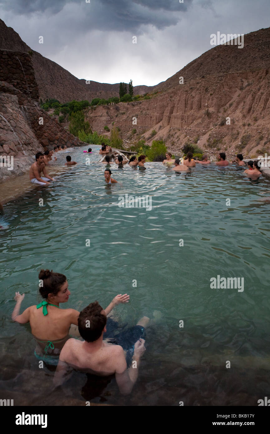 Couple relaxing in hot swimming pools in Cacheuta Thermal Springs ...