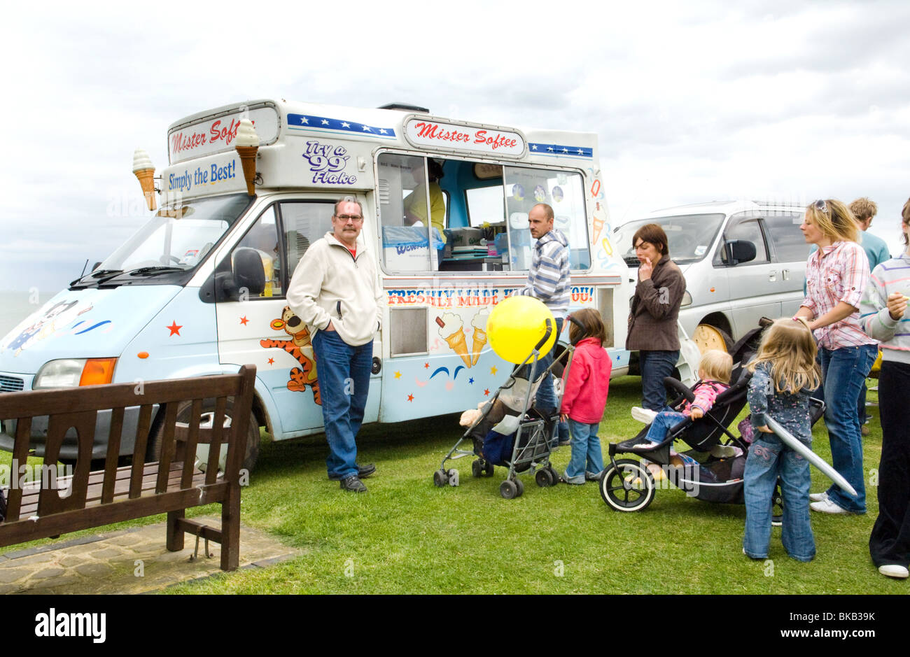 Mr Softee ice cream van and queue, woman at seaside ice-cream vendor ...