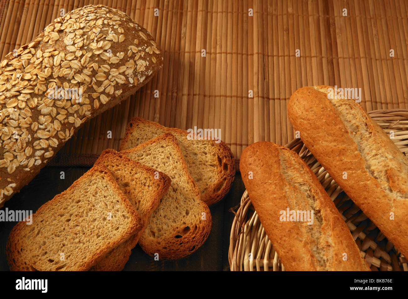 Varied cereal natural bread golden color still life Stock Photo - Alamy