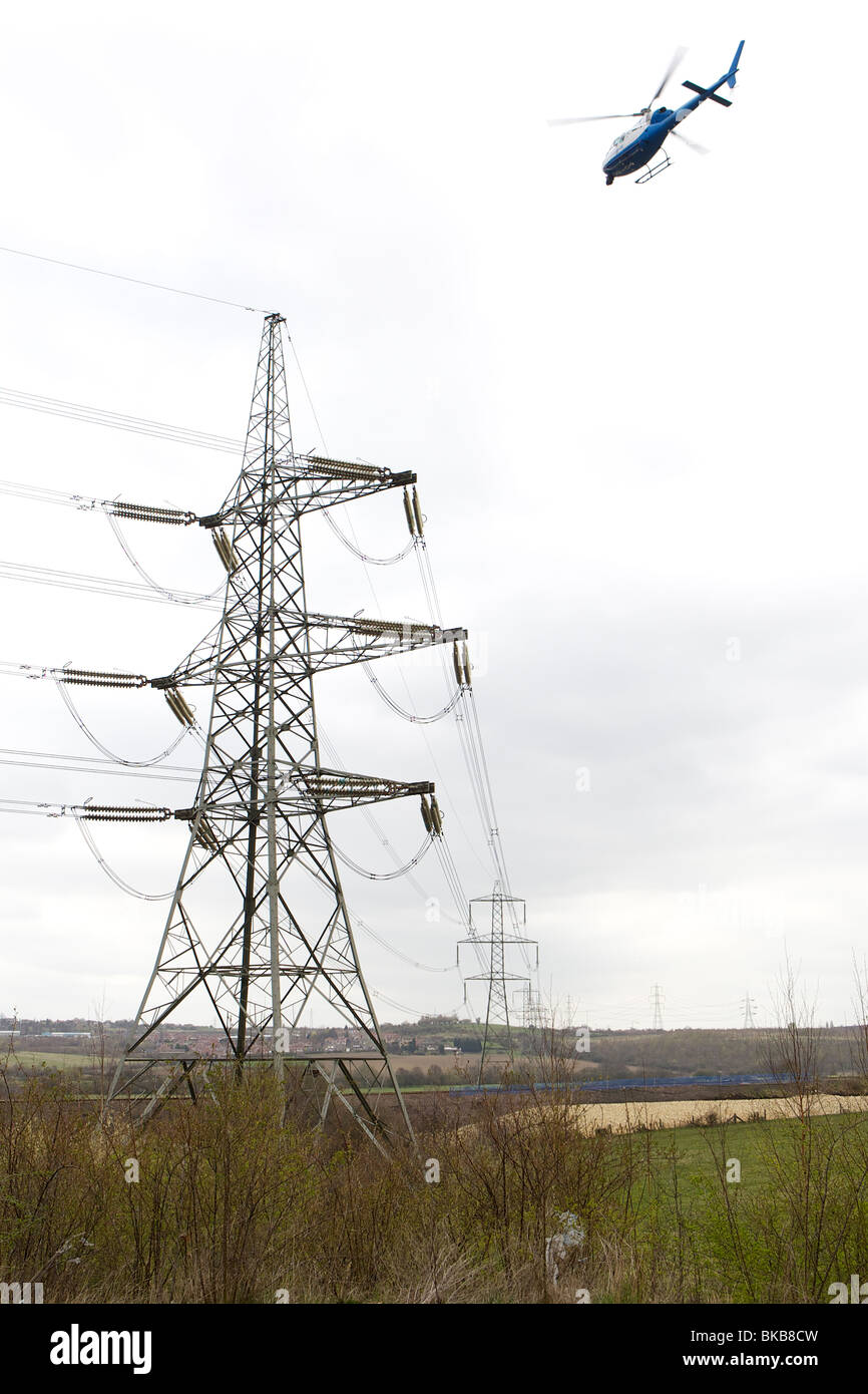 A National Grid helicopter checks out electricity pylons near Barnsley ...