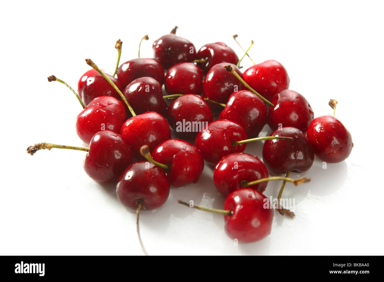 Cherry red fruits texture on white background Stock Photo - Alamy