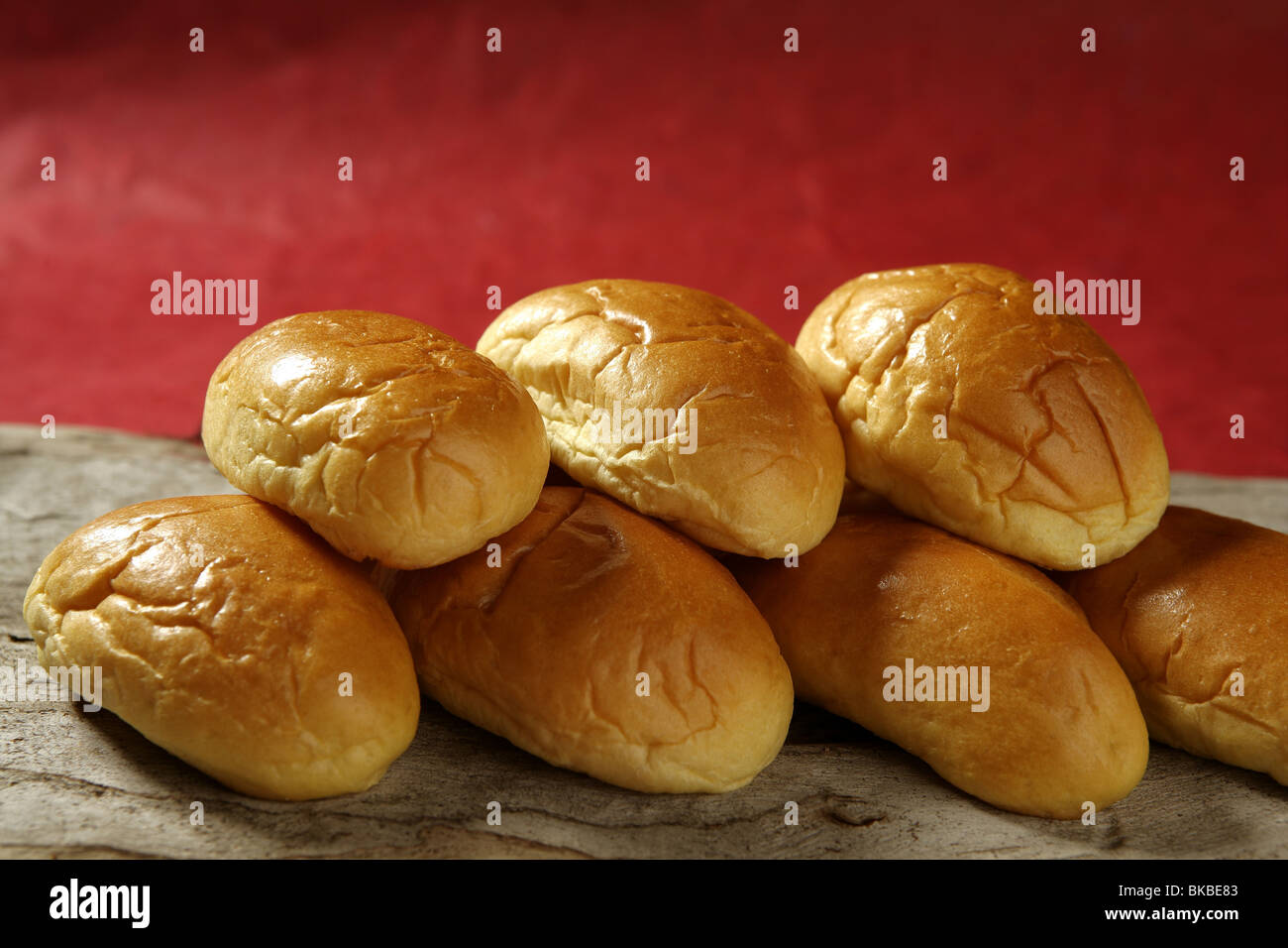 Brioche little bread stacked in two rows over red background Stock ...