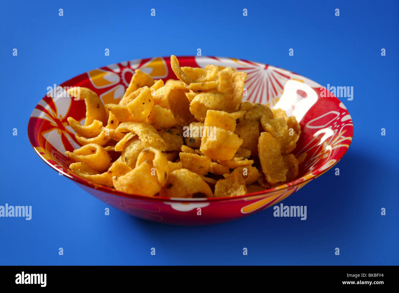 Fried corn golden snack in plate over blue background Stock Photo - Alamy