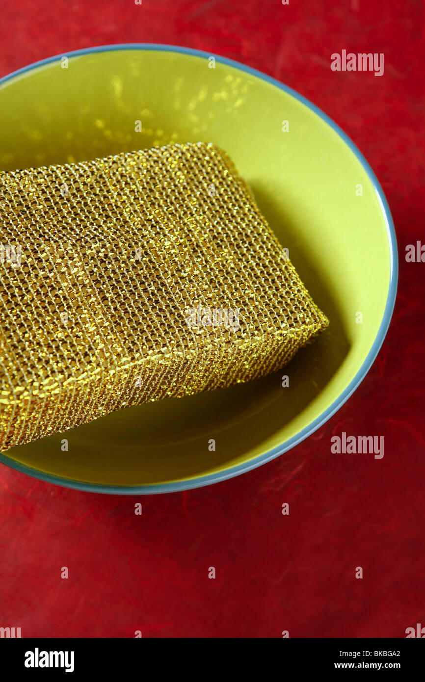 Housewife cleaning tools metaphor, sponge and bowl Stock Photo - Alamy