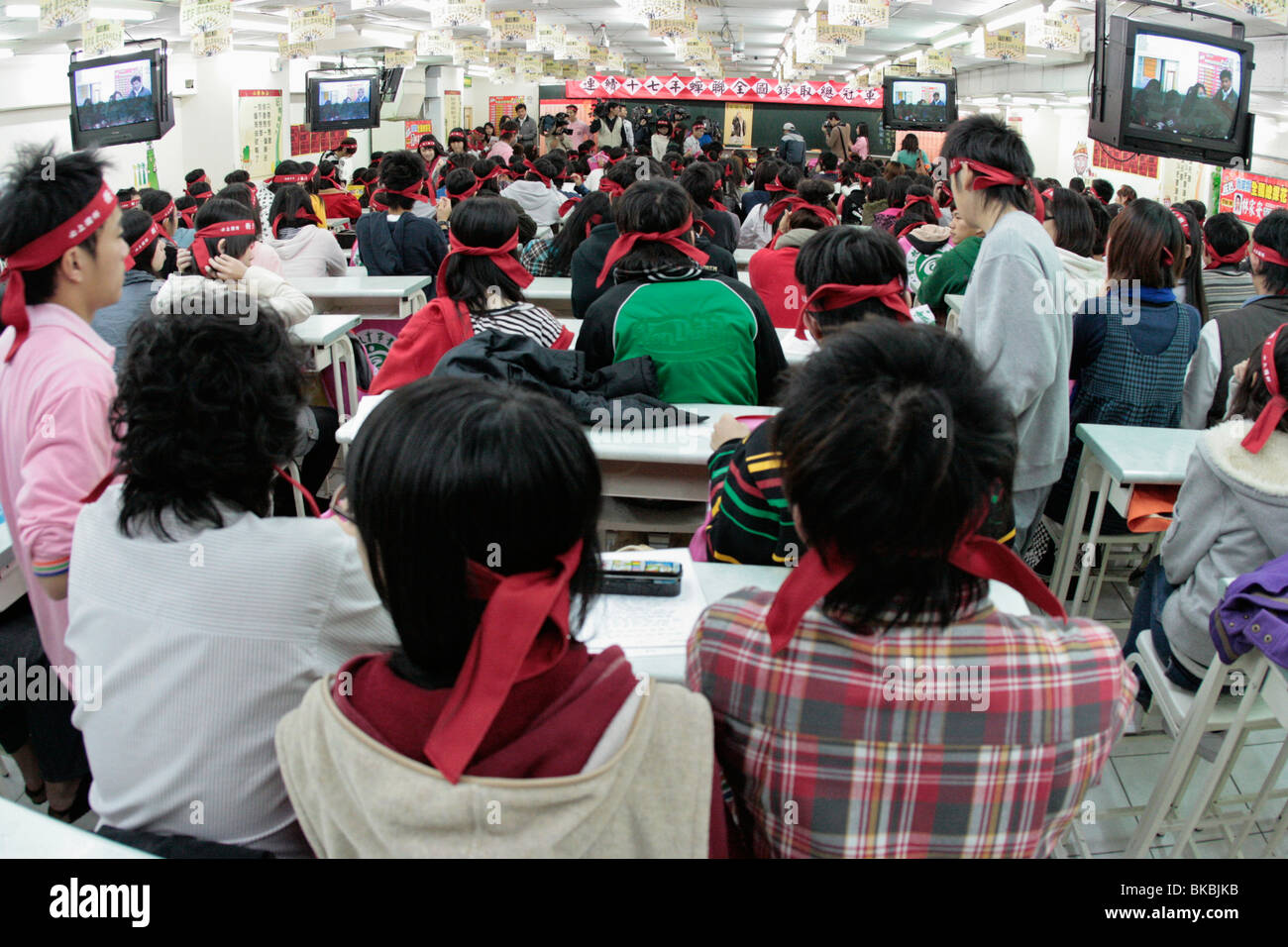 Youth sit in classroom for studying hard in order pass college ...