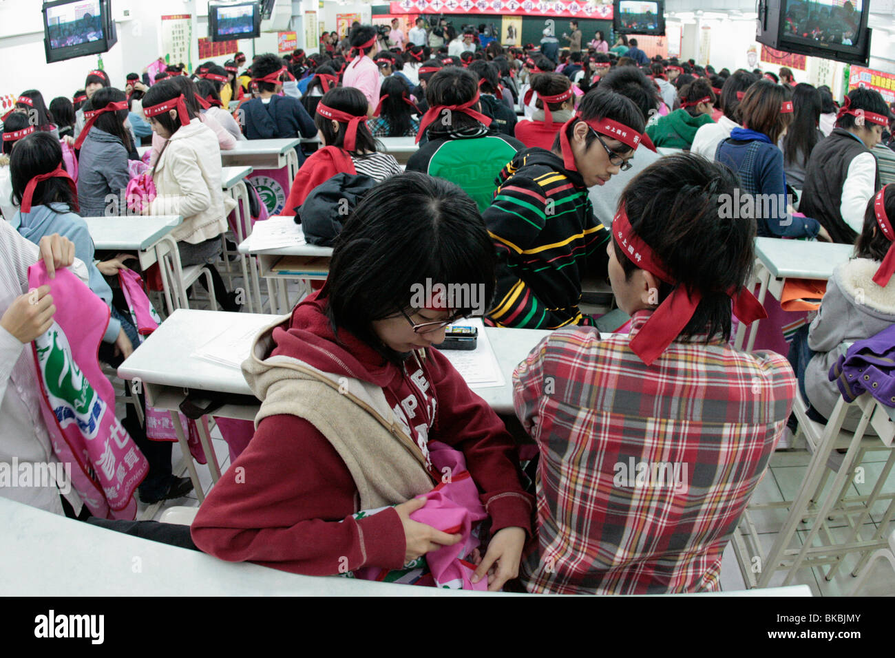 Youth sit in classroom for studying hard in order pass college ...