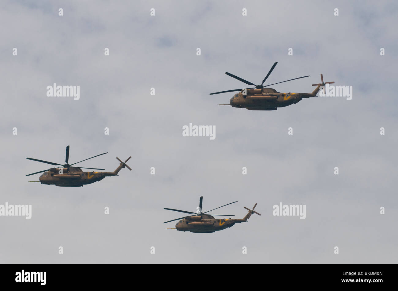 Three helicopters flying in formation hi-res stock photography and ...