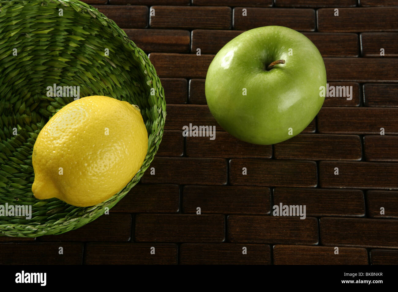 Yellow lemon a healthy C Vitamin citric fruit with one green apple ...