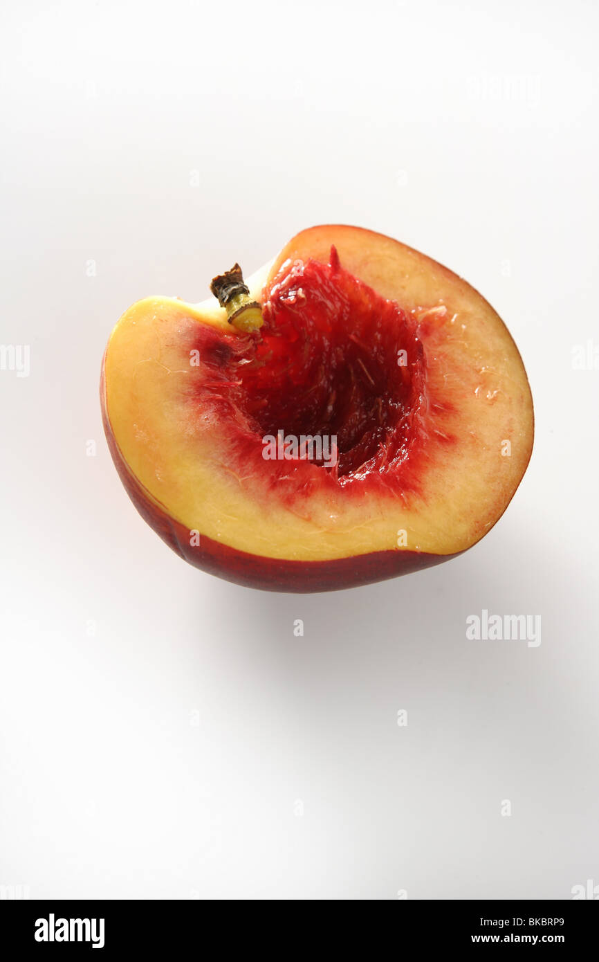 Metaphor of bloody inside of half peach Stock Photo - Alamy