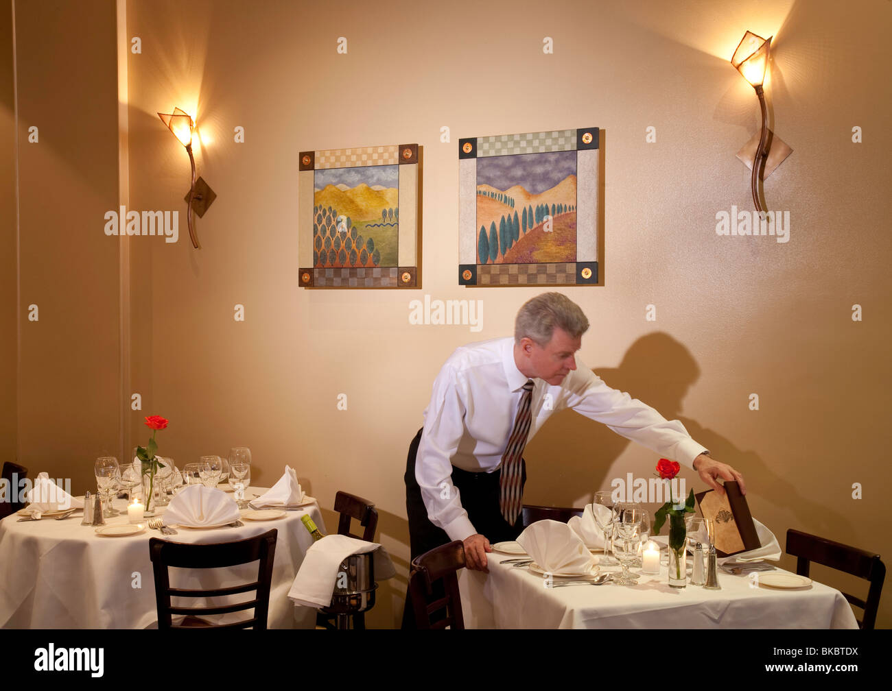 Waiter prepares restaurant tables hi-res stock photography and images ...