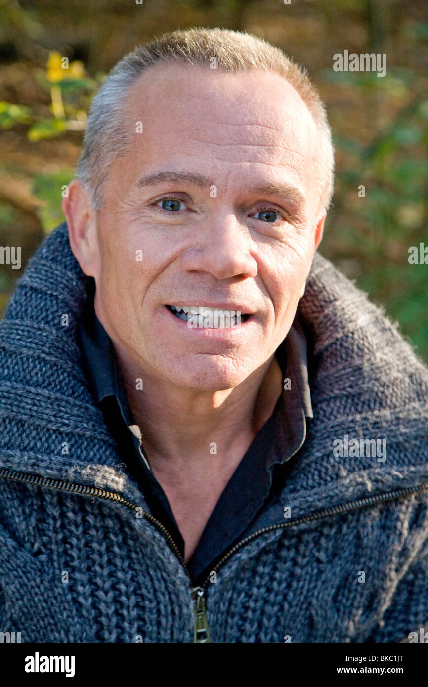 Older Man Walking in Woods Stock Photo - Alamy
