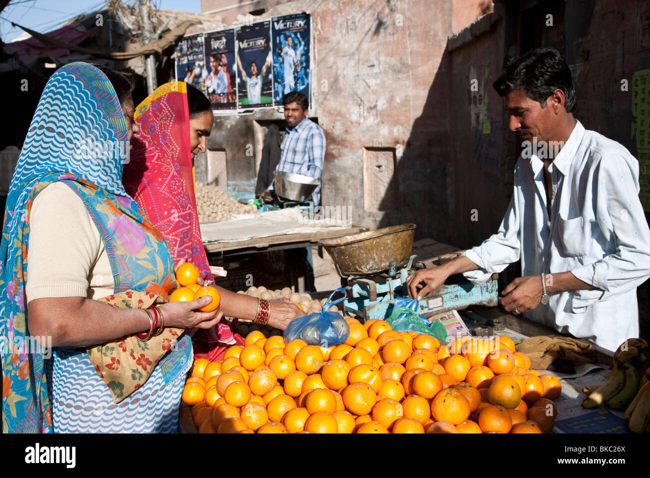 Indian women buying oranges. Bikaner market. Rajasthan. India Stock ...