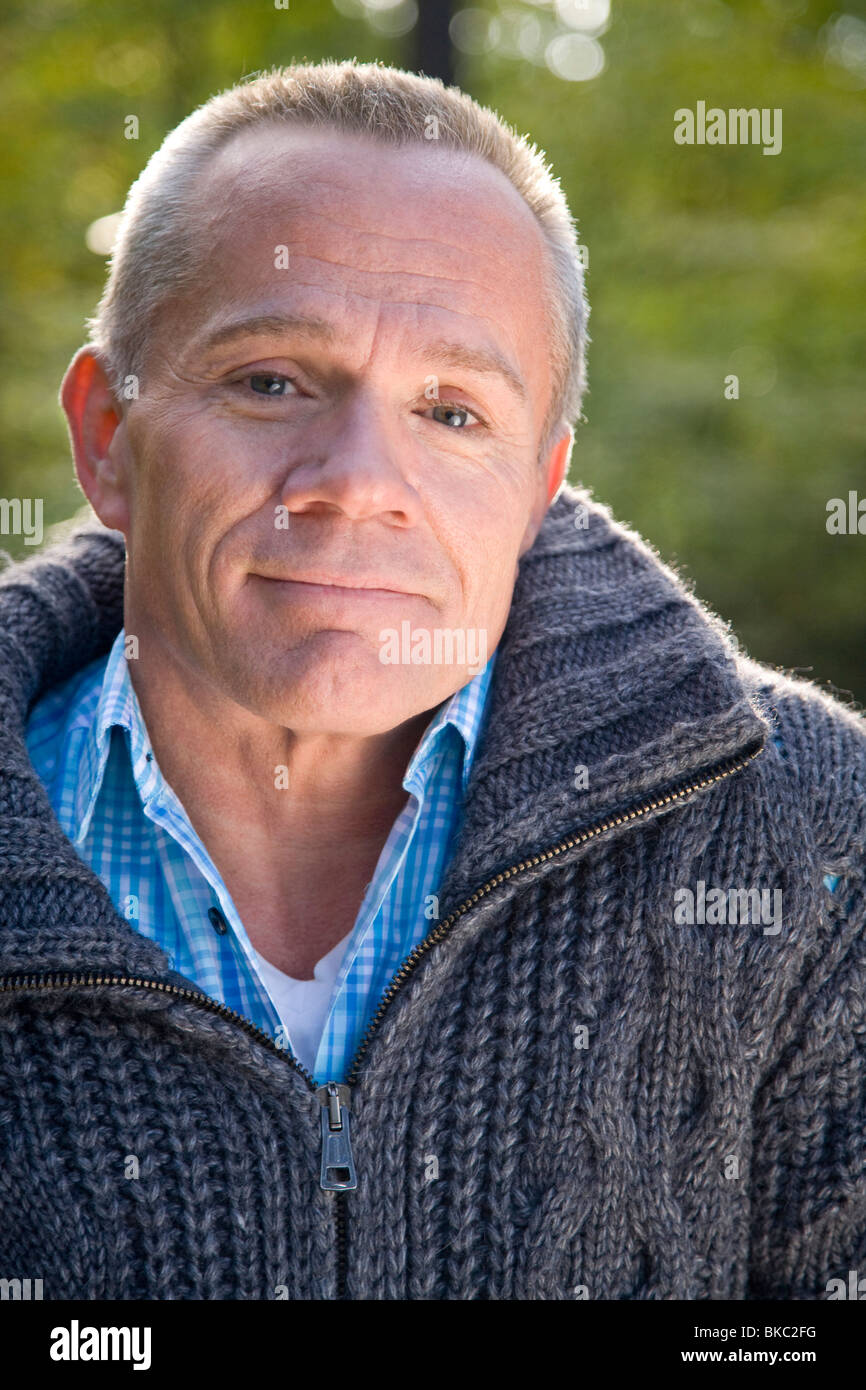 Older Man Walking in Woods Stock Photo - Alamy