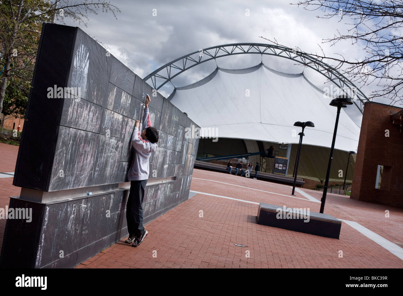 Boy draws on Community Chalkboard and Podium, Downtown Mall, Pavilion ...
