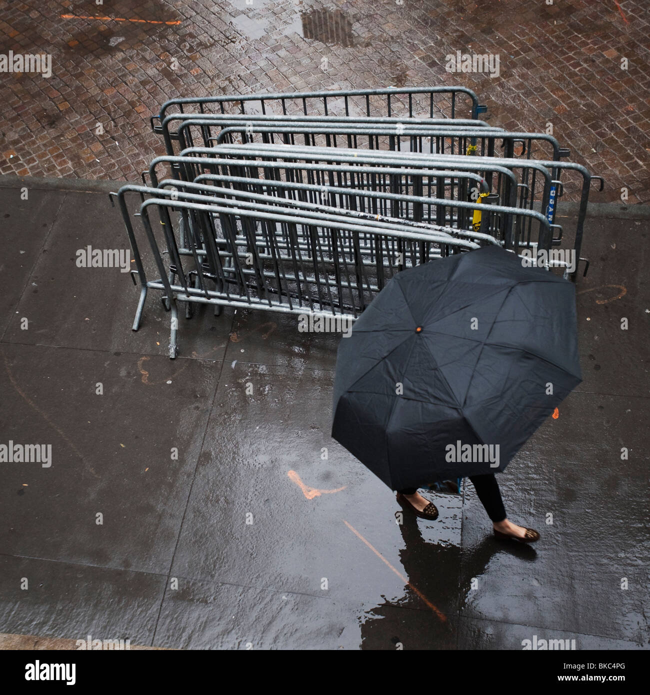 Woman Walking In The Rain With Umbrella Stock Photo - Alamy