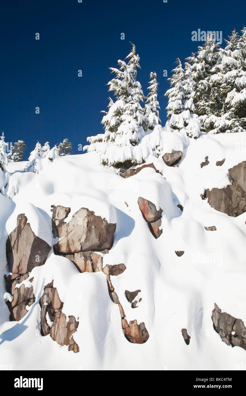 Fresh Snowfall On Rocky Cliff Stock Photo - Alamy