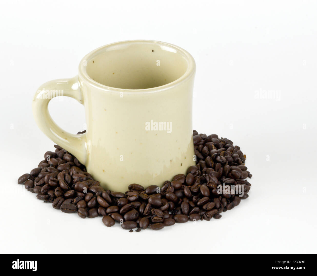 Iconic Coffee Mug in coffee beans on white background Stock Photo - Alamy