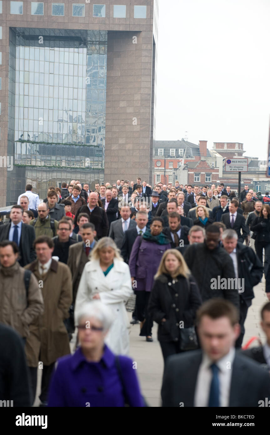 Commuters surging across London Bridge in the morning rush hour, 8am ...