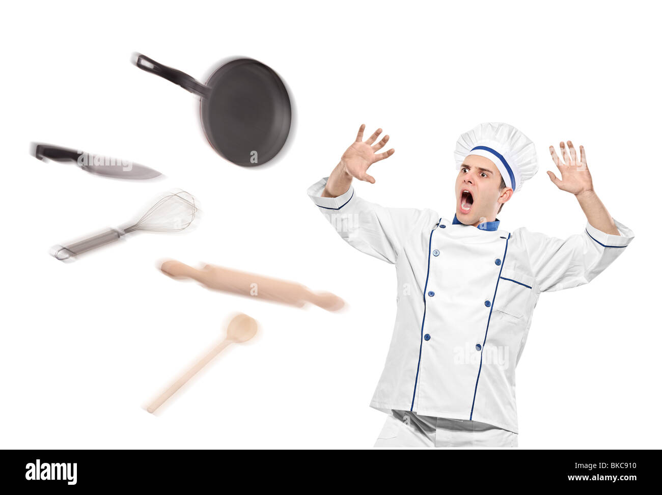 A view of flying kitchen utensils towards stunned chef Stock Photo - Alamy
