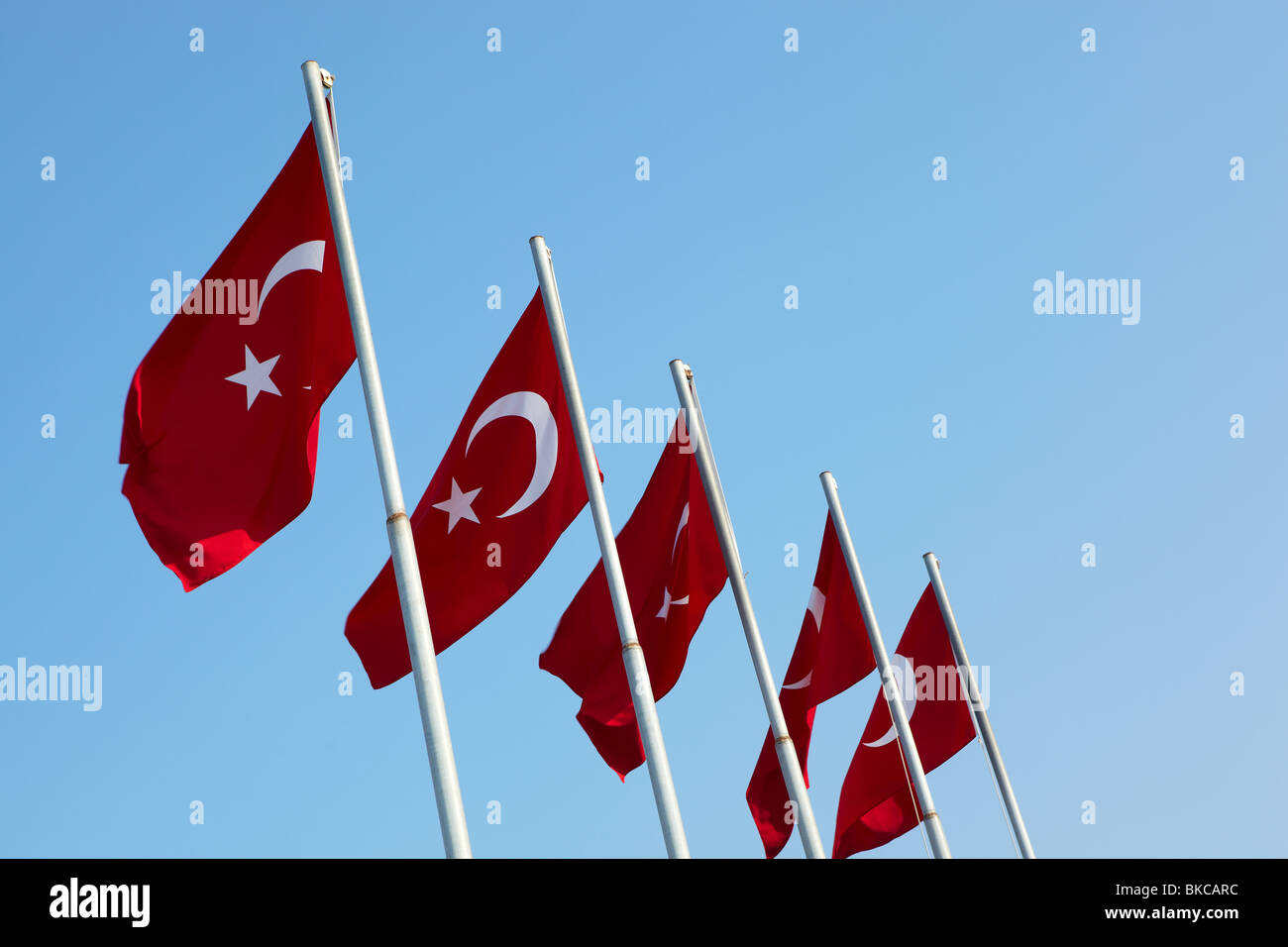 Red turkish flags blowing in the wind on a clear blue sky day Stock ...