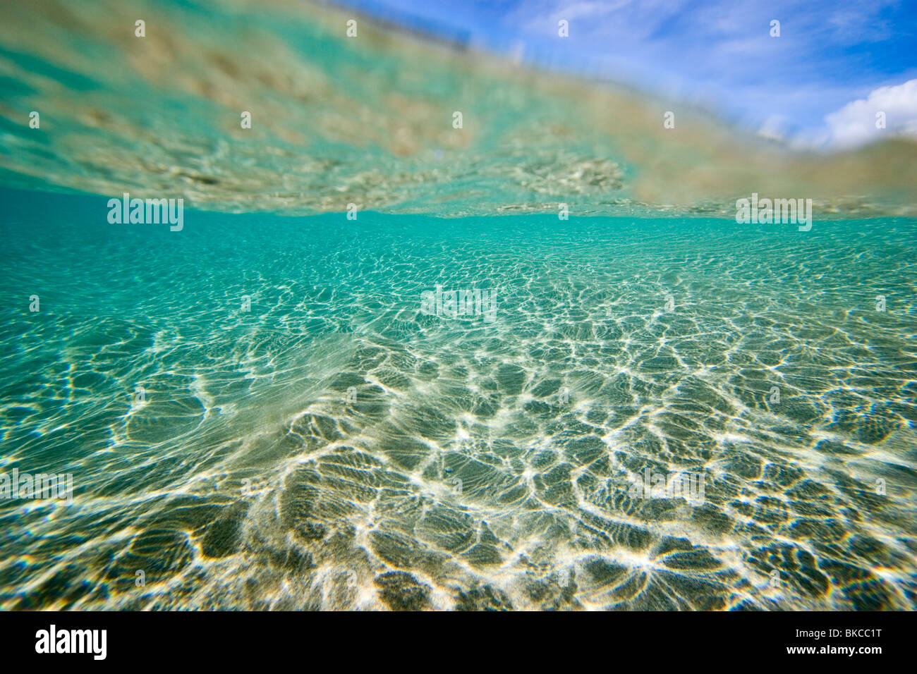An underwater view of sea and sky with a sandy bottom Stock Photo - Alamy