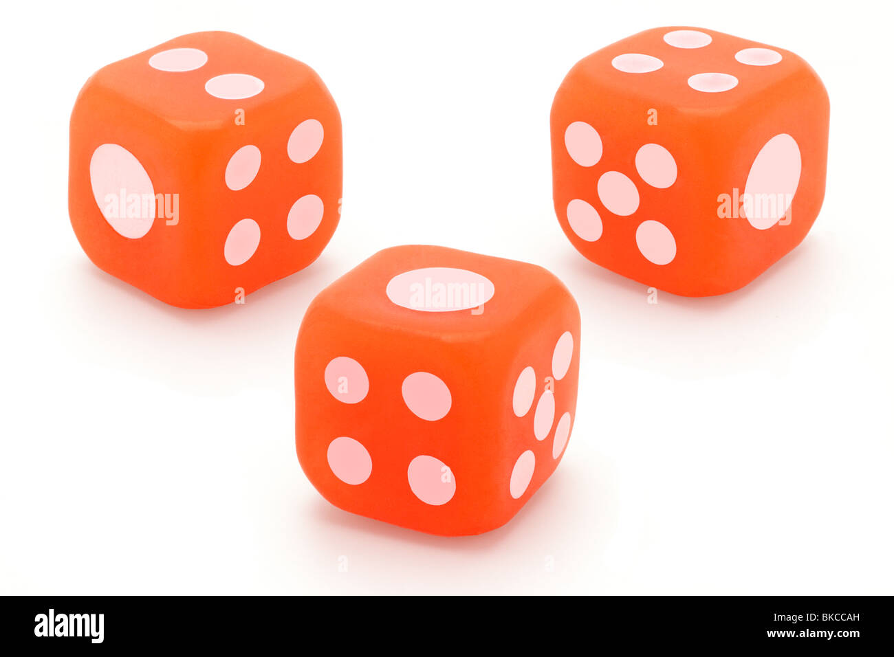 Three rubber dice arranged on white background Stock Photo - Alamy