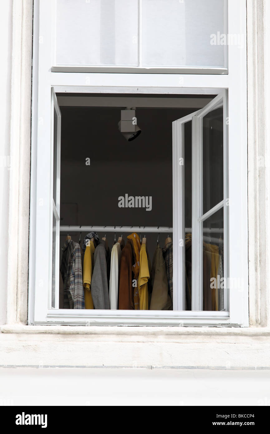 Open Window with clothing Stock Photo - Alamy