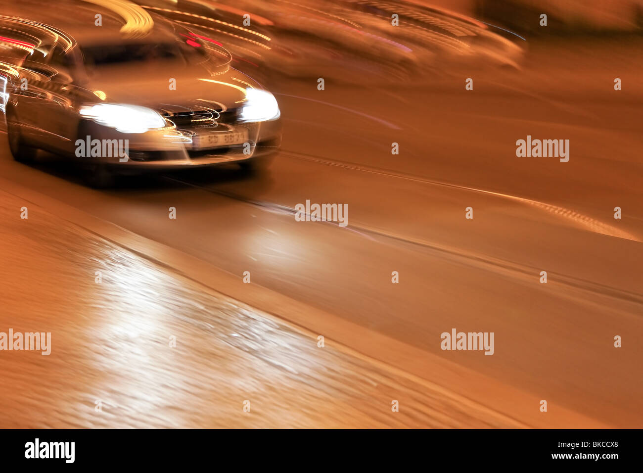 A speeding car with lights at night on a road Stock Photo - Alamy