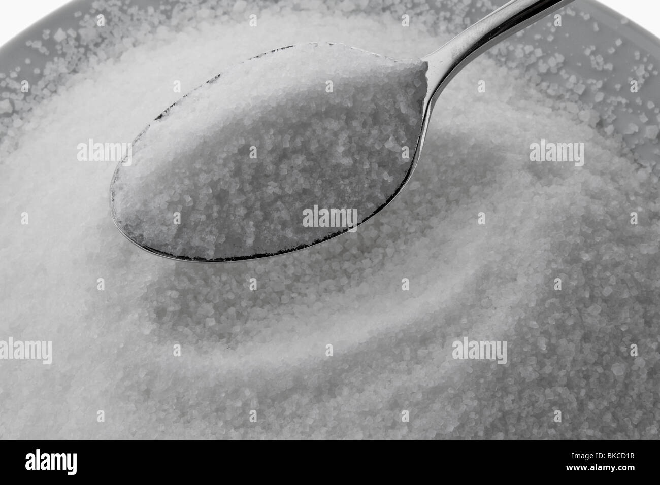 Fine granulated sugar on a spoon Stock Photo - Alamy