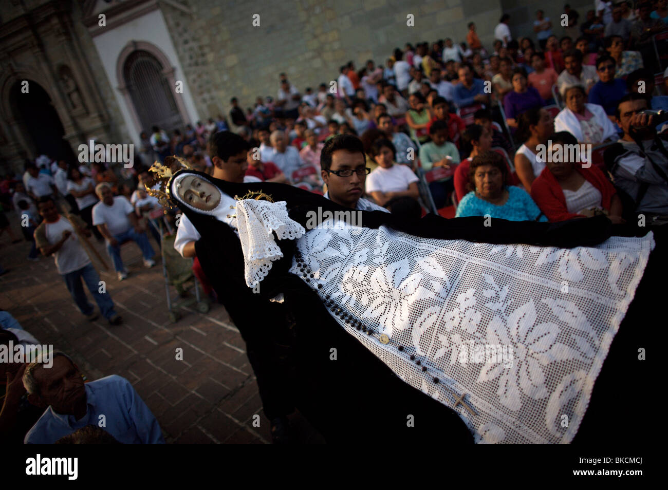 Men carry a statue of the Virgin of Solitude during holy week ...
