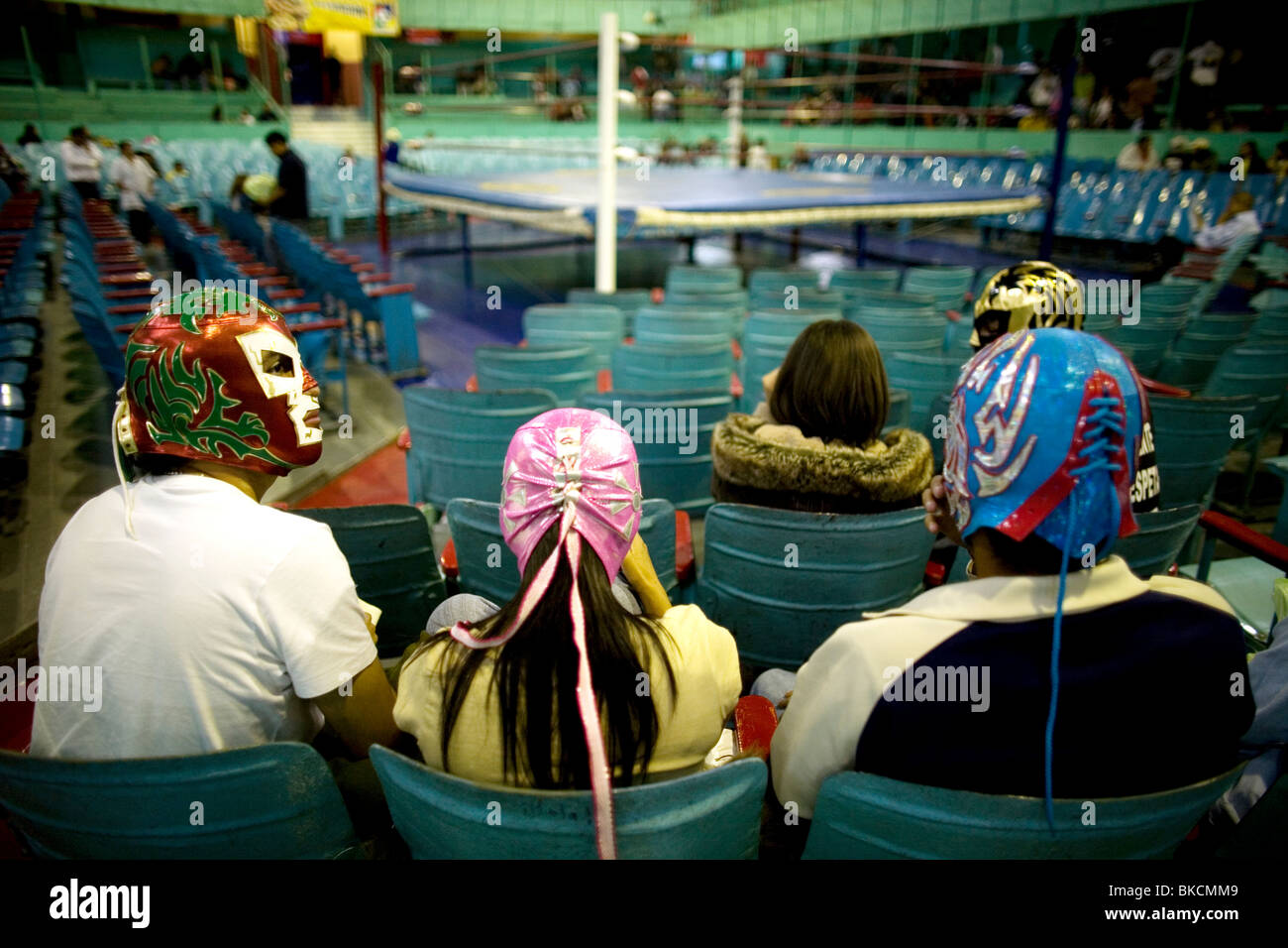Lucha Libre fans wait for the start of a fight in Puebla Arena in ...