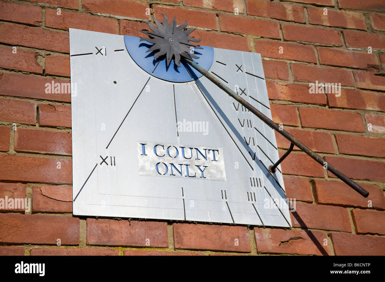 Metal sundial on the side of a building Stock Photo - Alamy