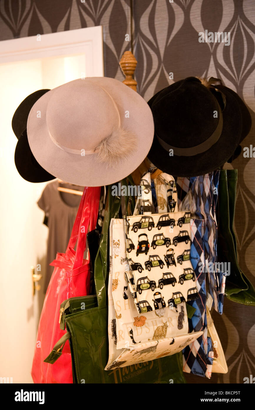 Charity shop hat and bag stand Stock Photo - Alamy