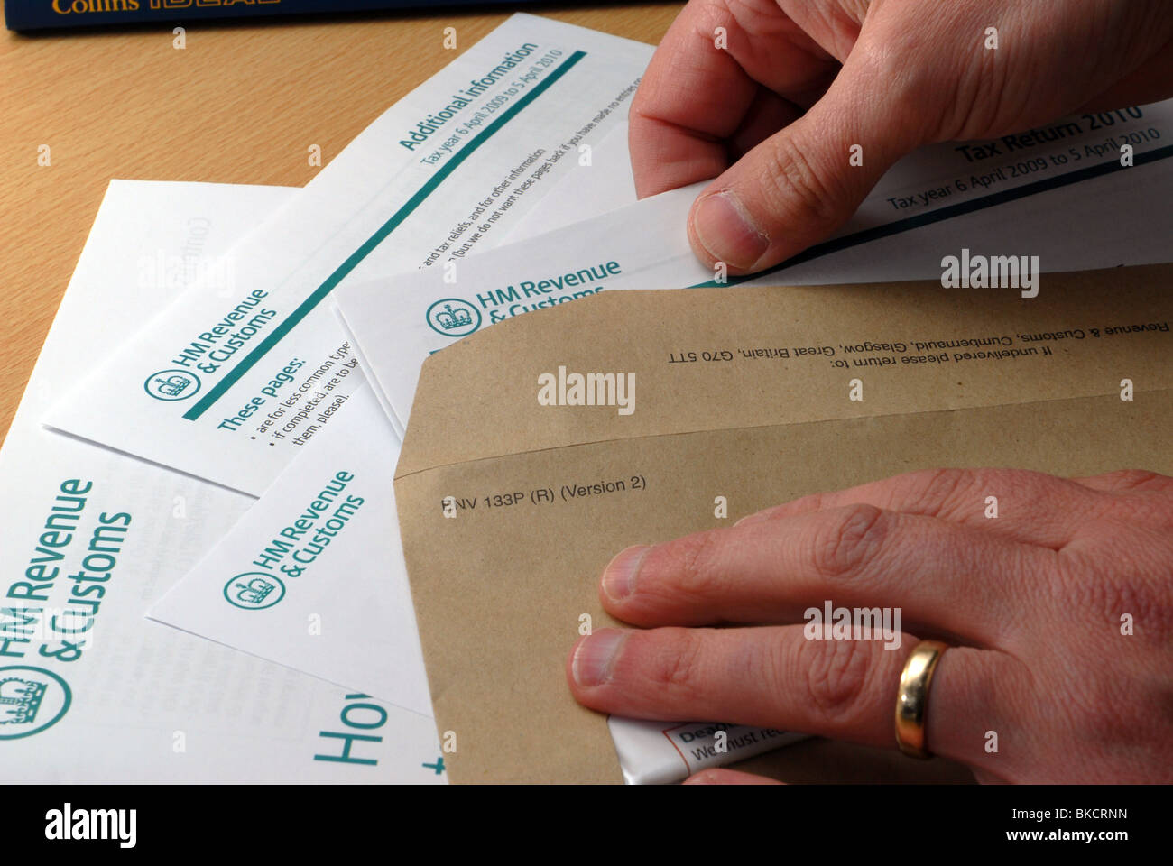 Completed Tax Return being dutifully put in an envelope to post back to ...