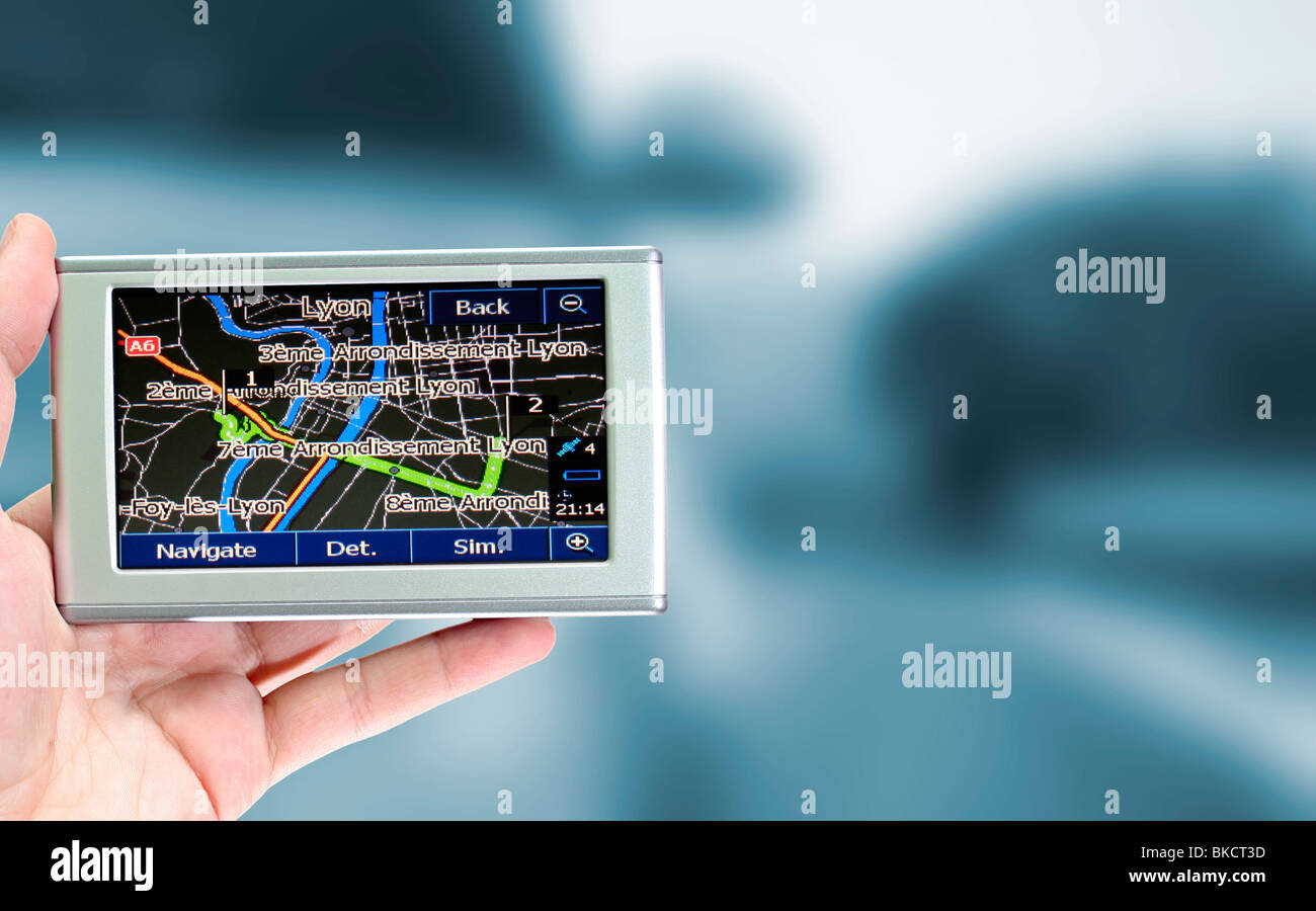 Gps in a man hand. Find your way ! Stock Photo - Alamy