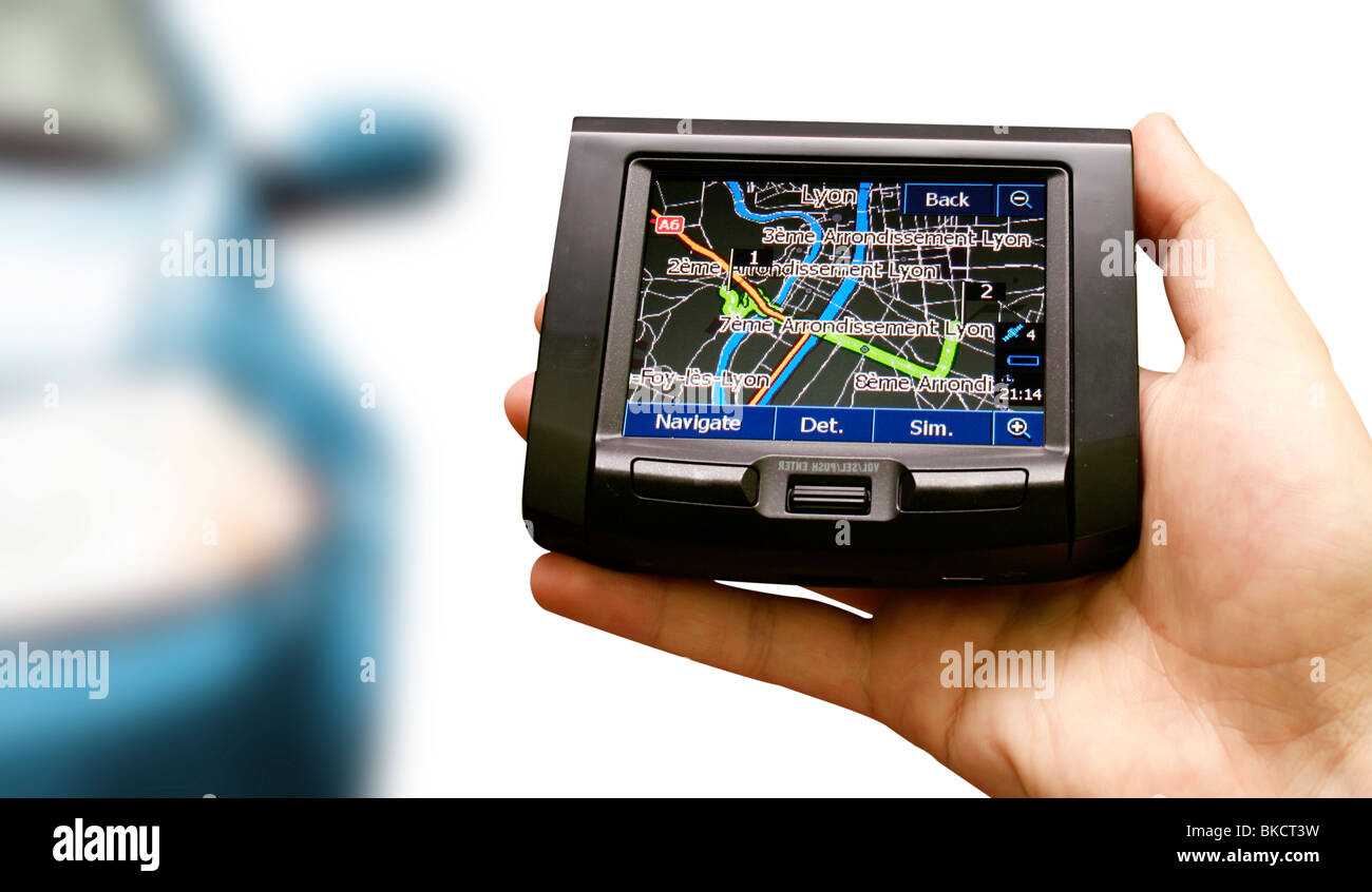 Gps in a man hand. Find your way ! Stock Photo - Alamy
