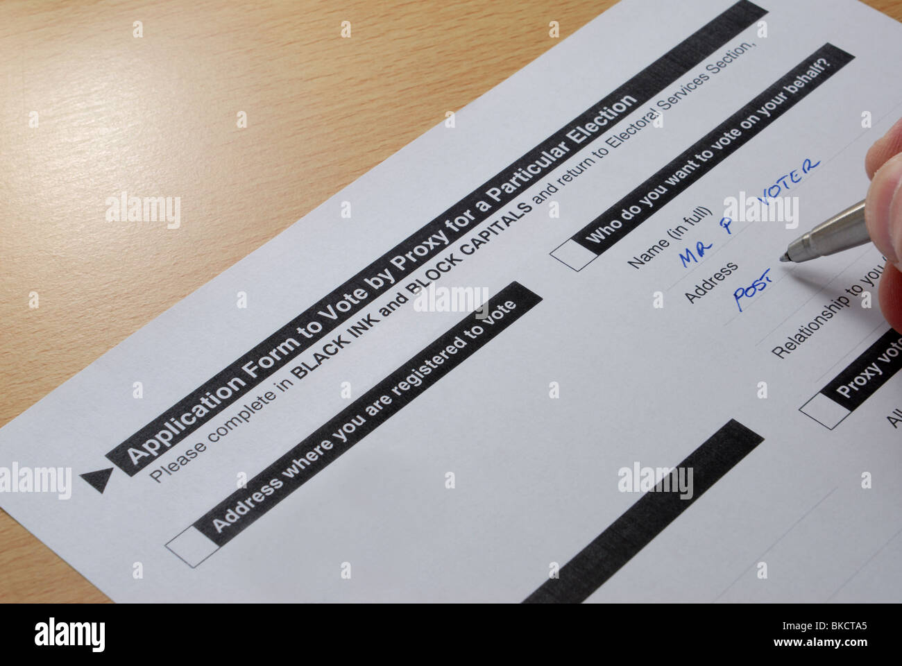 Completing an application form to apply for proxy or postal vote for an ...