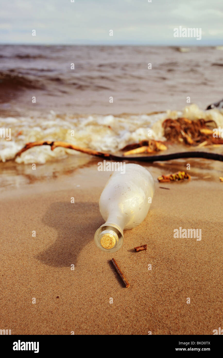 Message in a bottle on a sea beach Stock Photo - Alamy